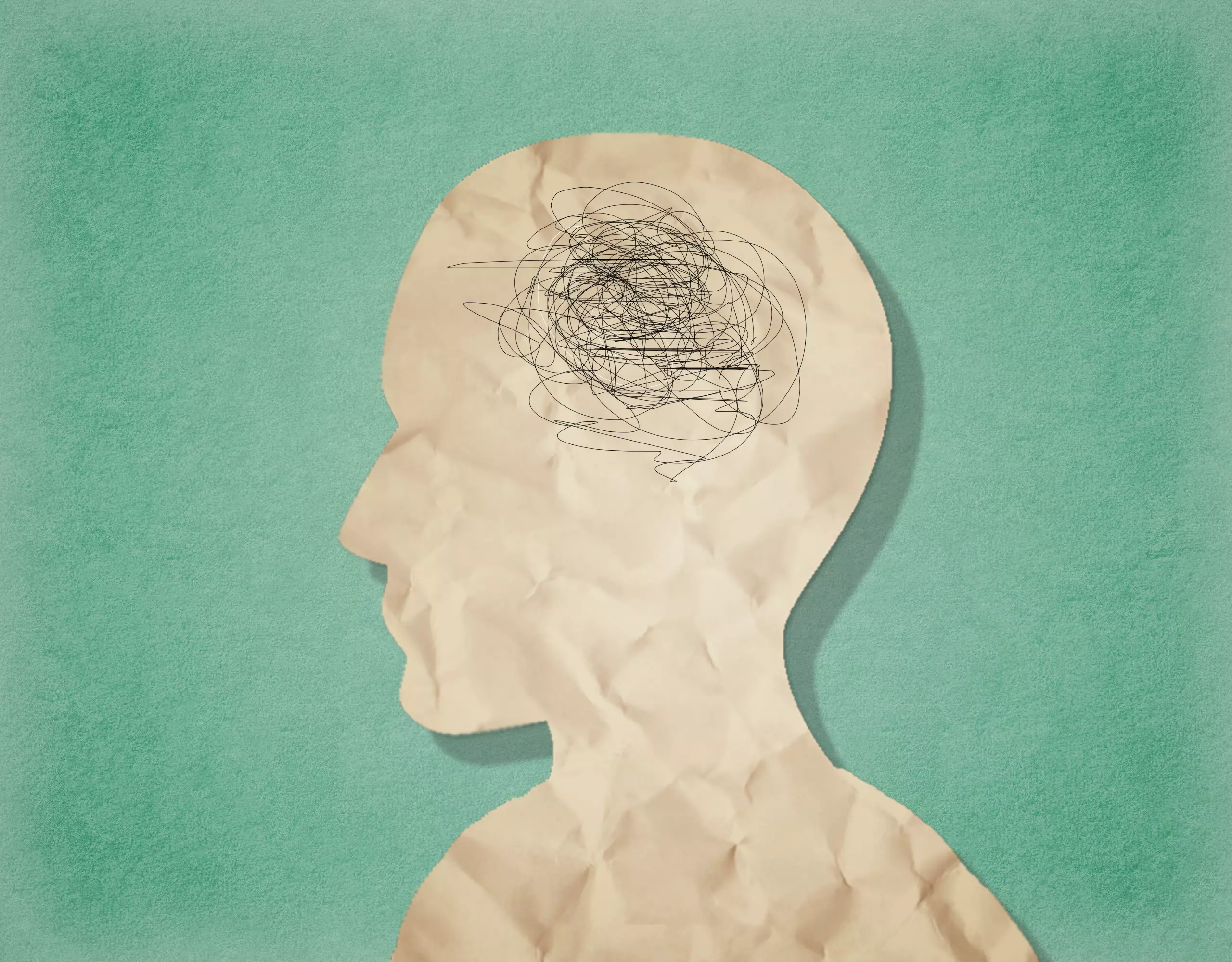 Imagine conceptuală ilustrativă a unui cap de hârtie cu mâzgălire în mijloc pentru a indica confuzia