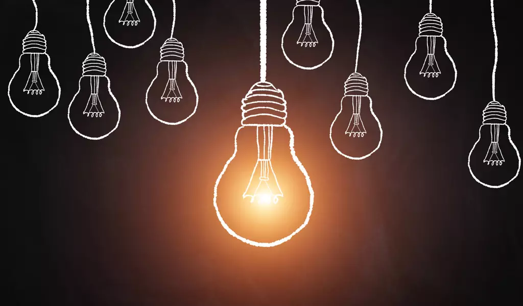 Ilustração de lâmpadas simbolizando grandes ideias na carreira de adulto com TDAH