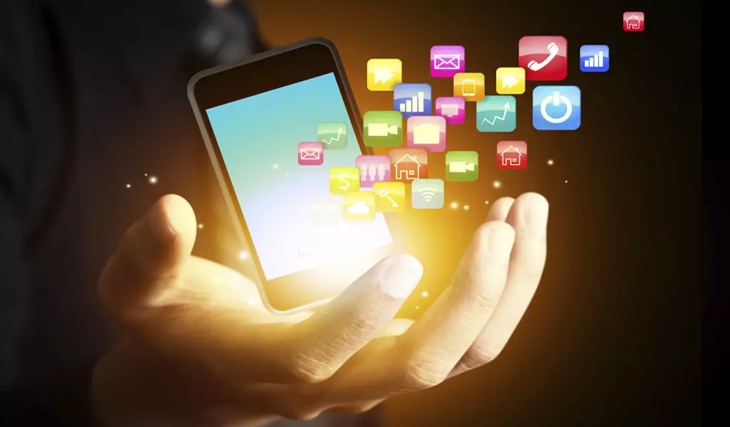 Illustration eines iPhones, das in der Hand einer ADHS-Person schwebt, mit Dutzenden von App-Symbolen, die aus dem Telefon schweben